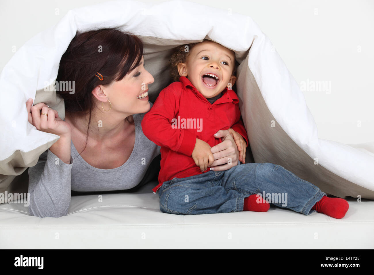 Woman playing a hiding game Stock Photo - Alamy