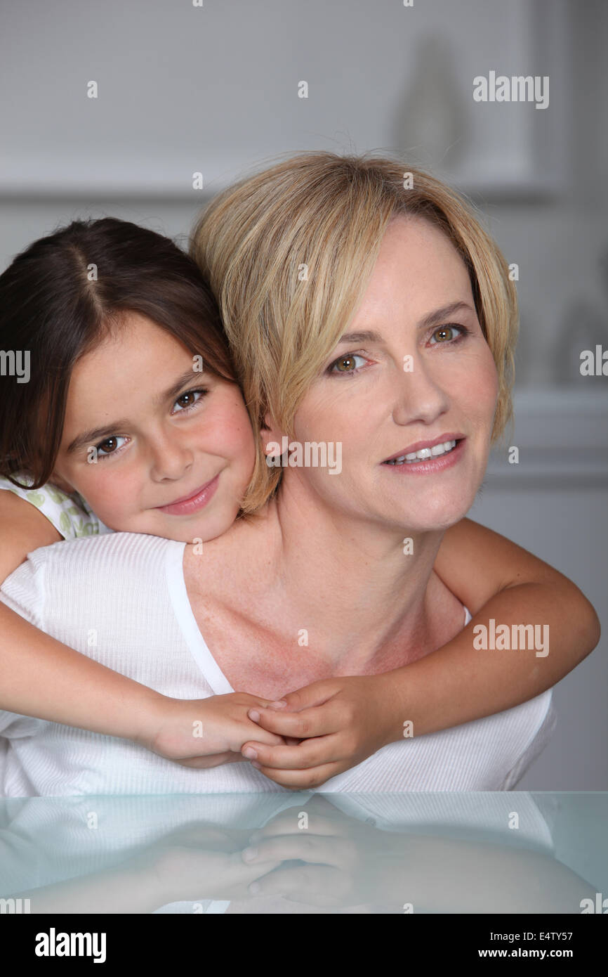 mother and daughter embracing Stock Photo - Alamy
