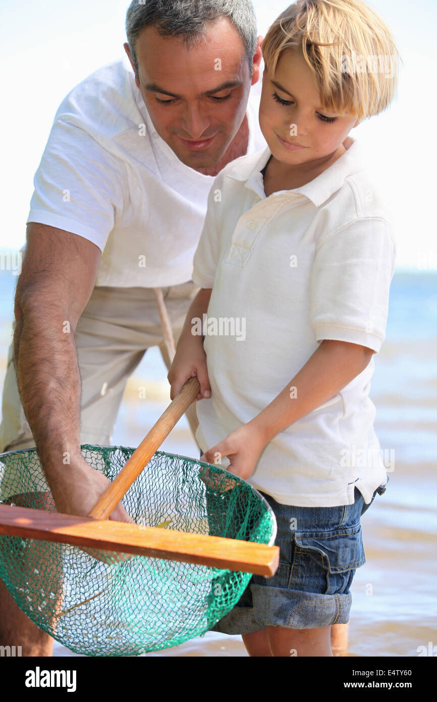 Father and son fishing Stock Photo - Alamy