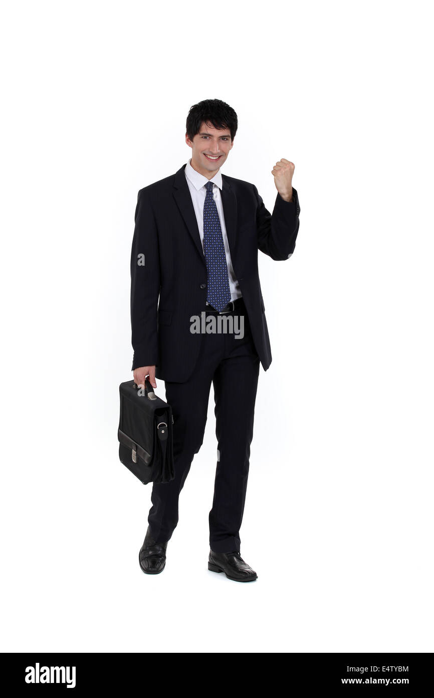 Young businessman celebrating promotion Stock Photo - Alamy