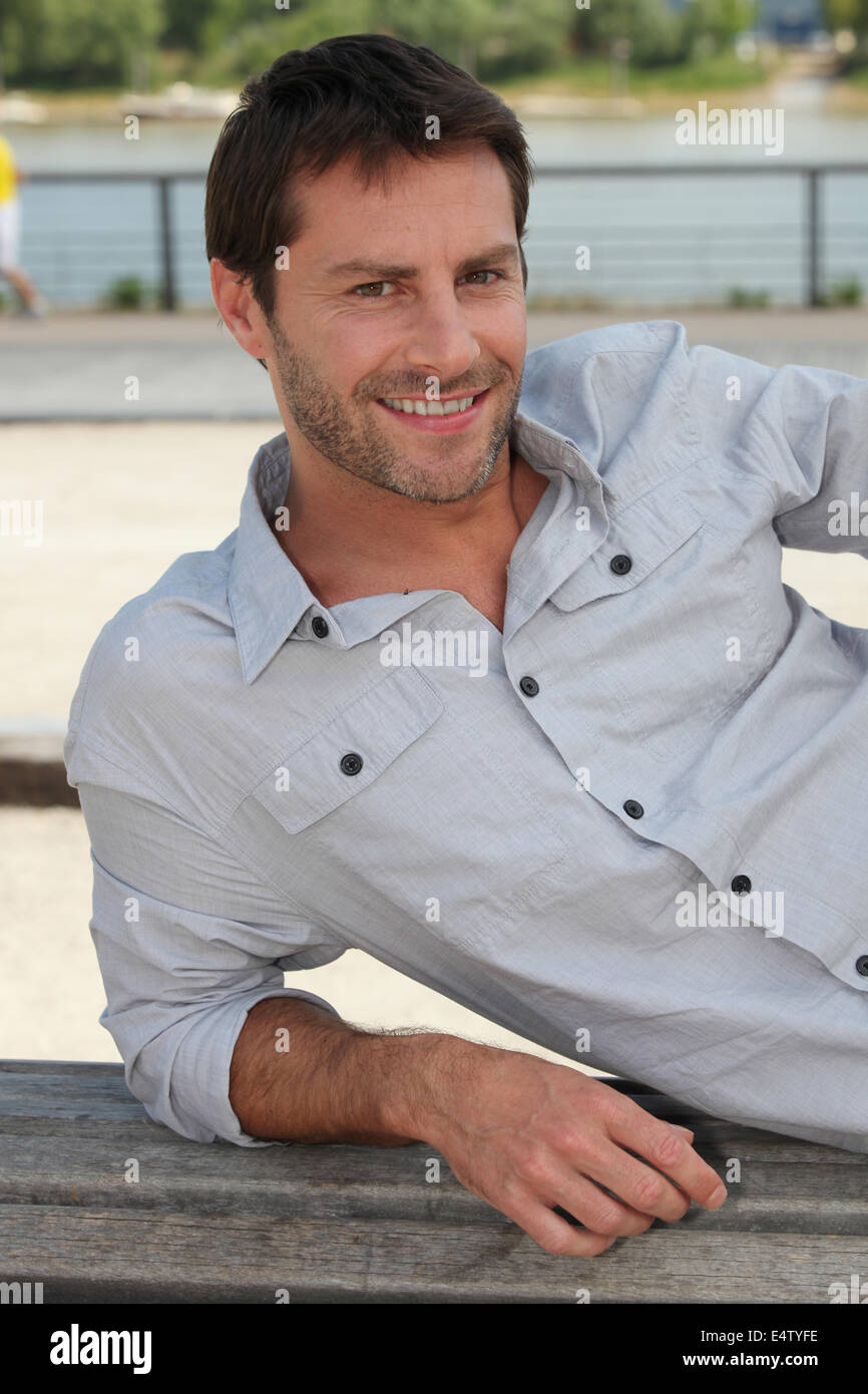 Man on a bench Stock Photo - Alamy