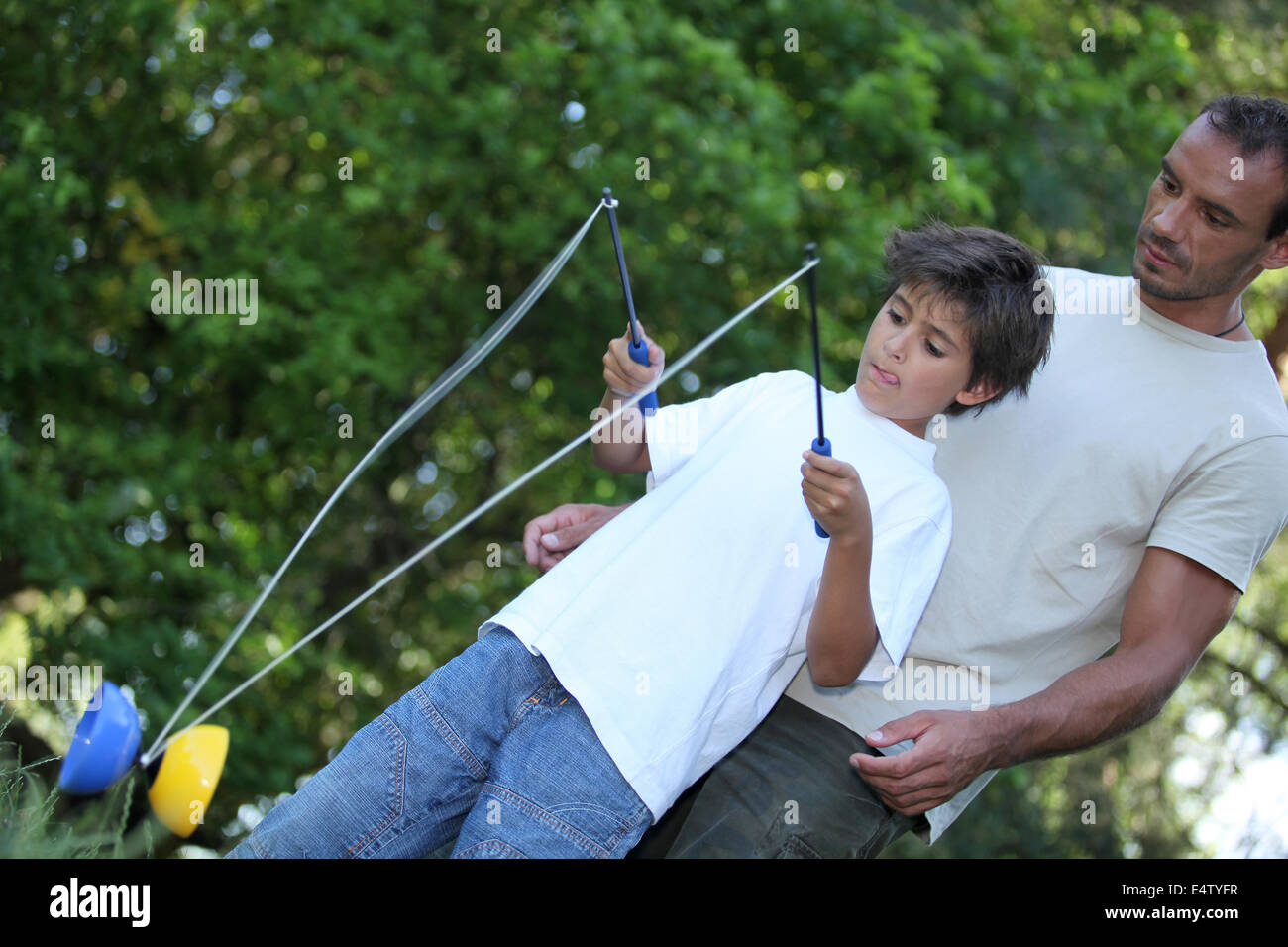 Son playing with diabolo Stock Photo - Alamy