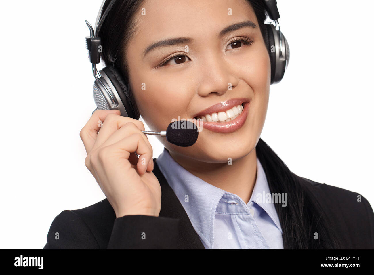 Smiling Asian call centre operator Stock Photo - Alamy