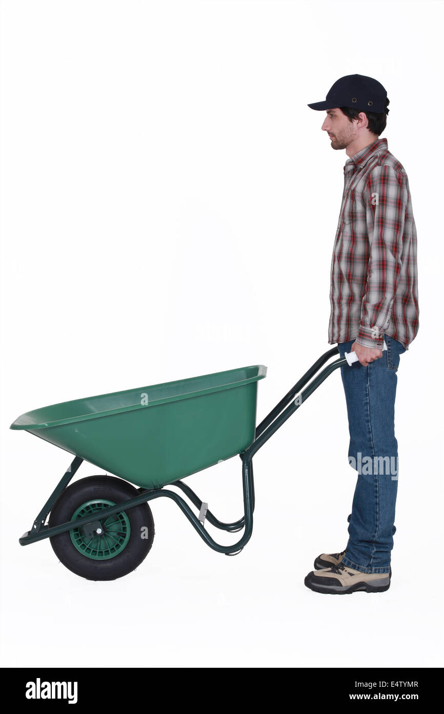 Loading wheelbarrow hi-res stock photography and images - Alamy