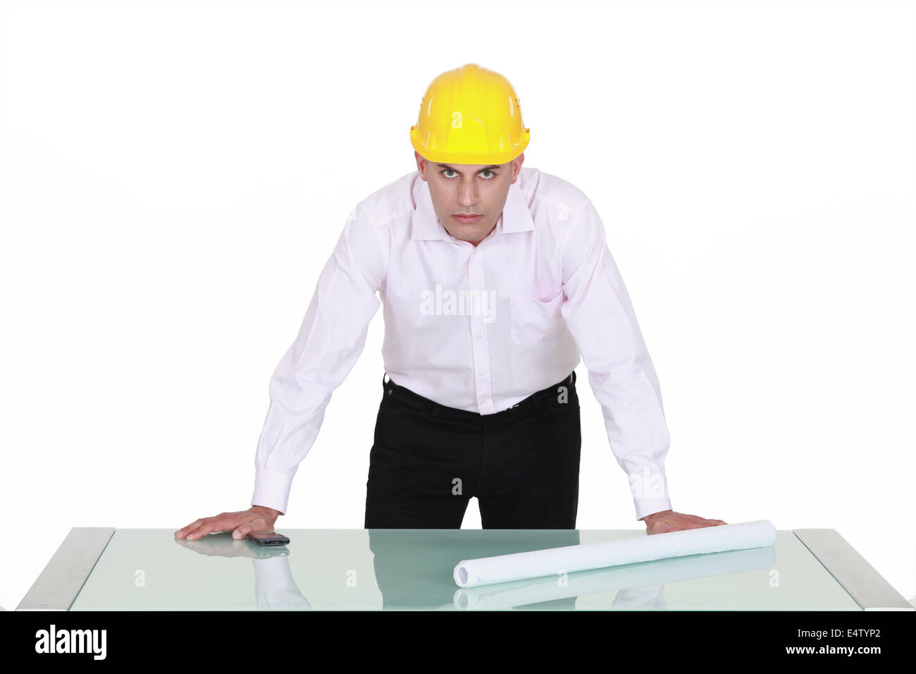Architect leaning over a drawing table Stock Photo - Alamy