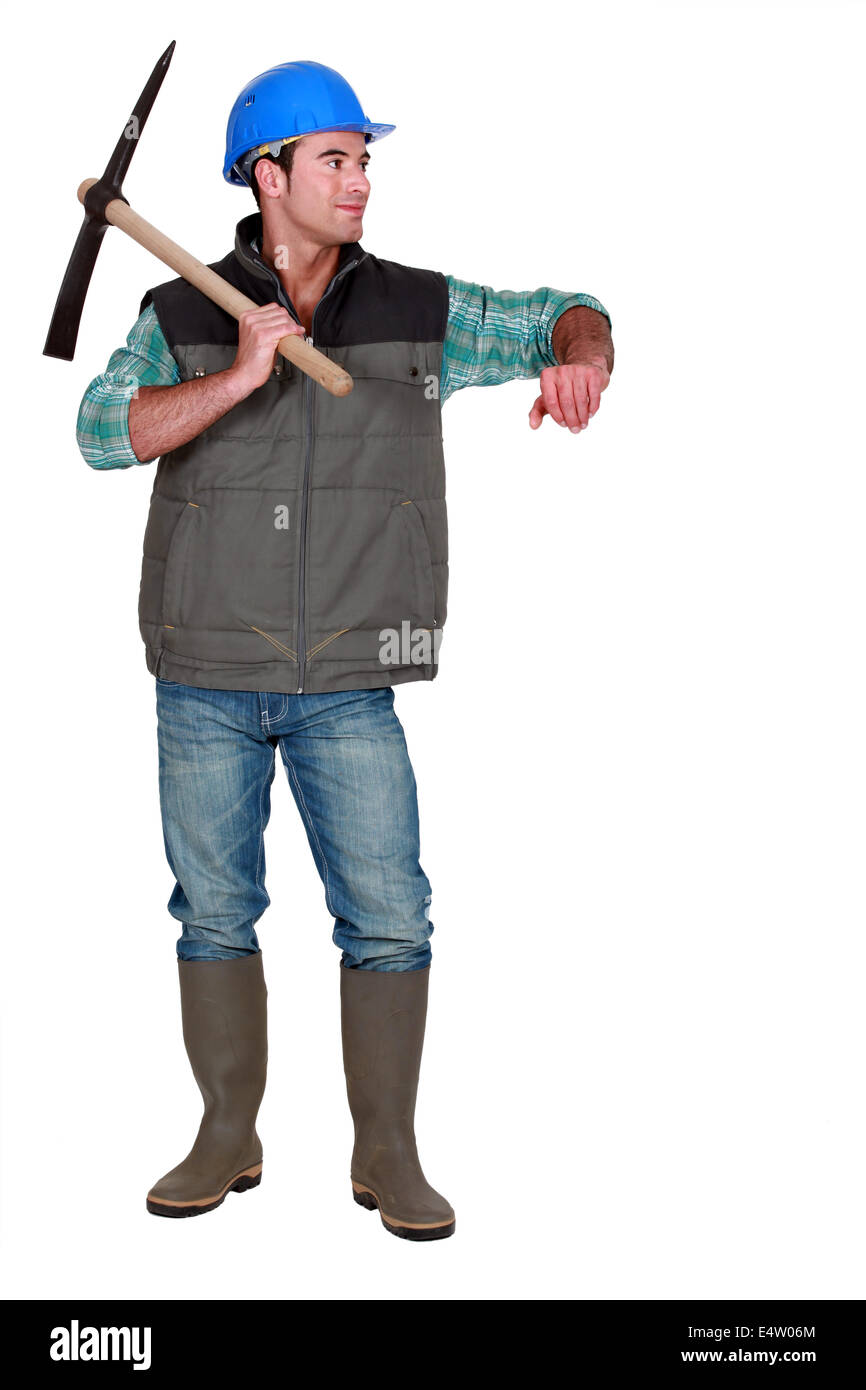 A male construction worker with a pickaxe Stock Photo - Alamy