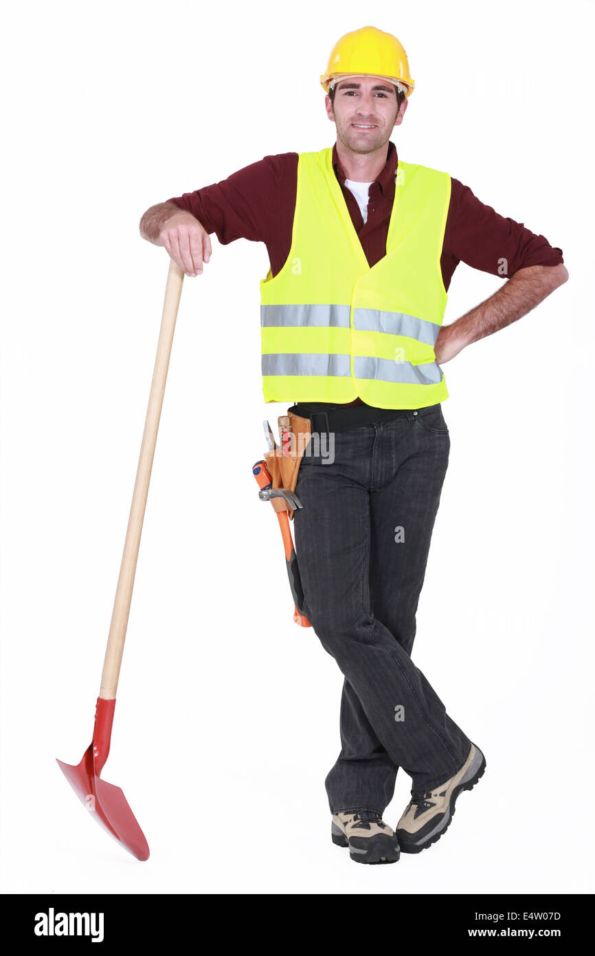 Worker with spade Stock Photo - Alamy