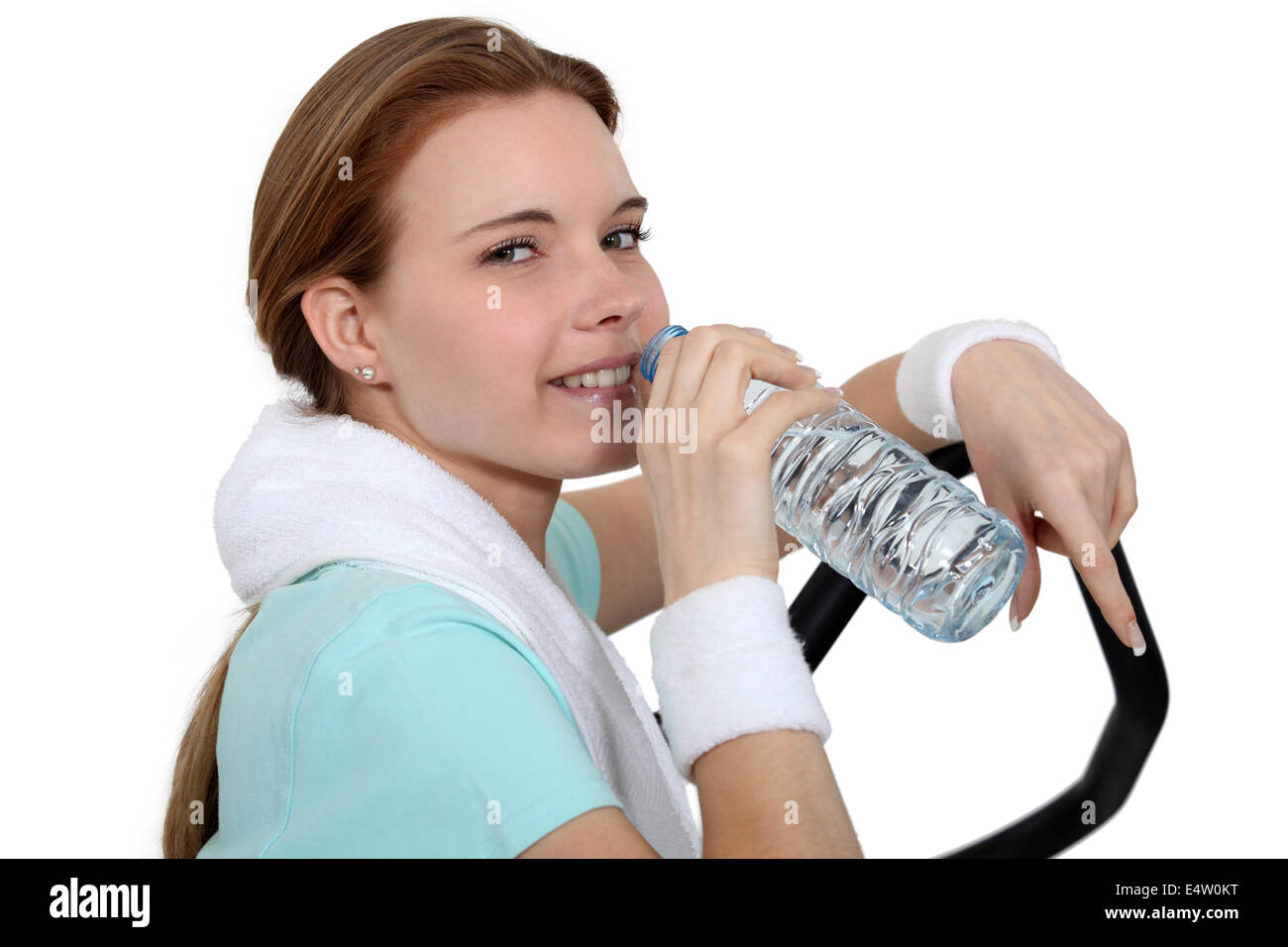Woman drinking water during a workout Stock Photo - Alamy