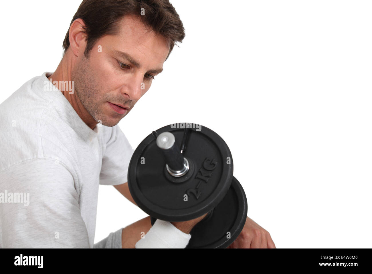 Man working out with dumbbell Stock Photo - Alamy