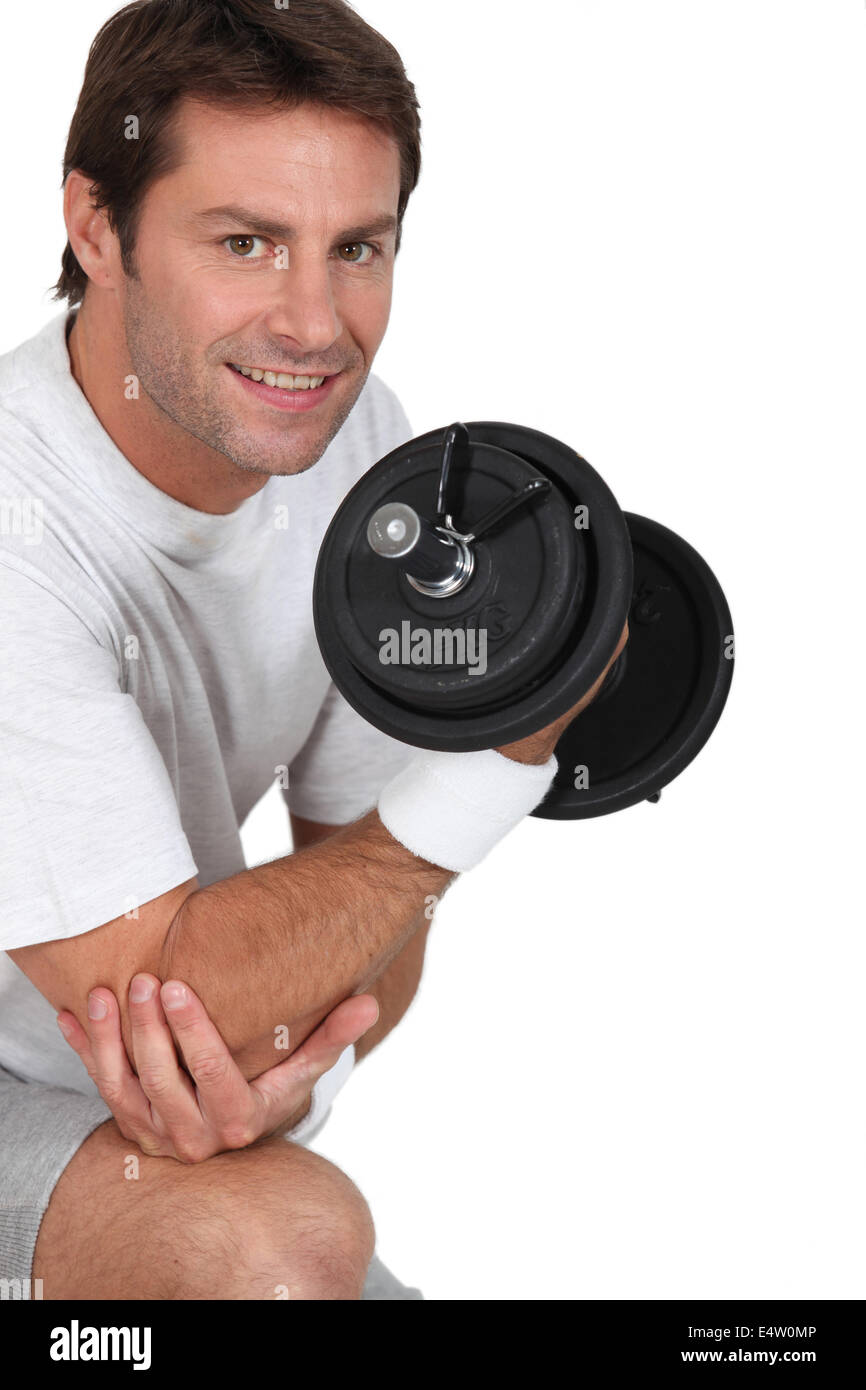 Man lifting weights Stock Photo - Alamy
