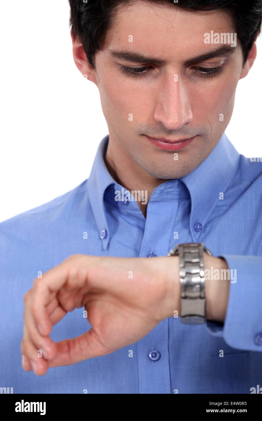 Businessman looking at his watch Stock Photo - Alamy