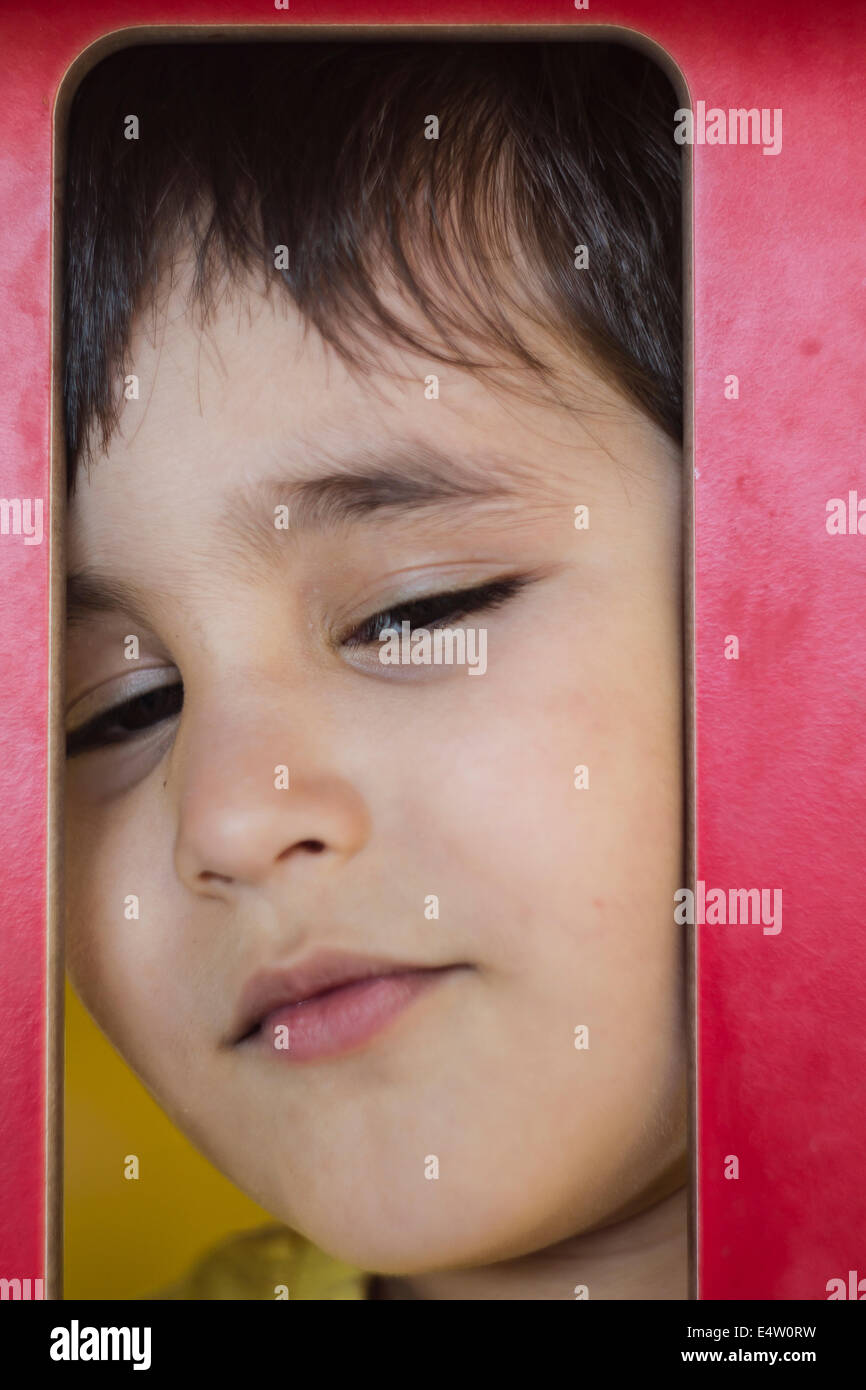 Handsome child in a park putting expressive faces Stock Photo - Alamy