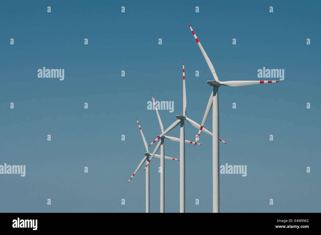Wind turbine farm on blue sky background Stock Photo - Alamy