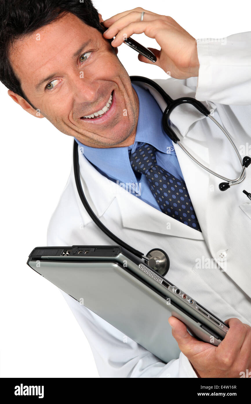 Doctor on the phone with computer Stock Photo - Alamy