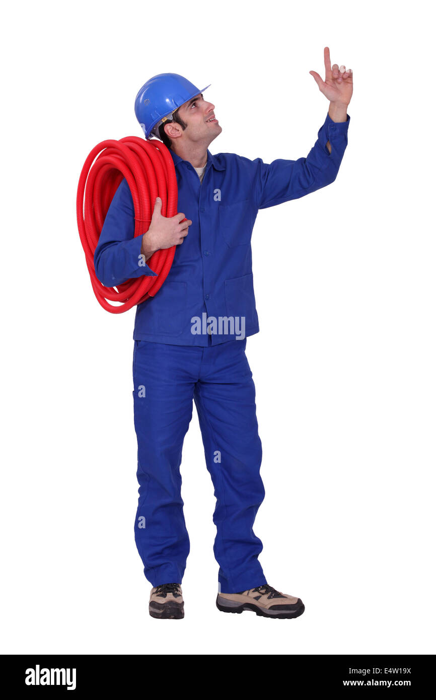 Plumber pointing upwards Stock Photo - Alamy