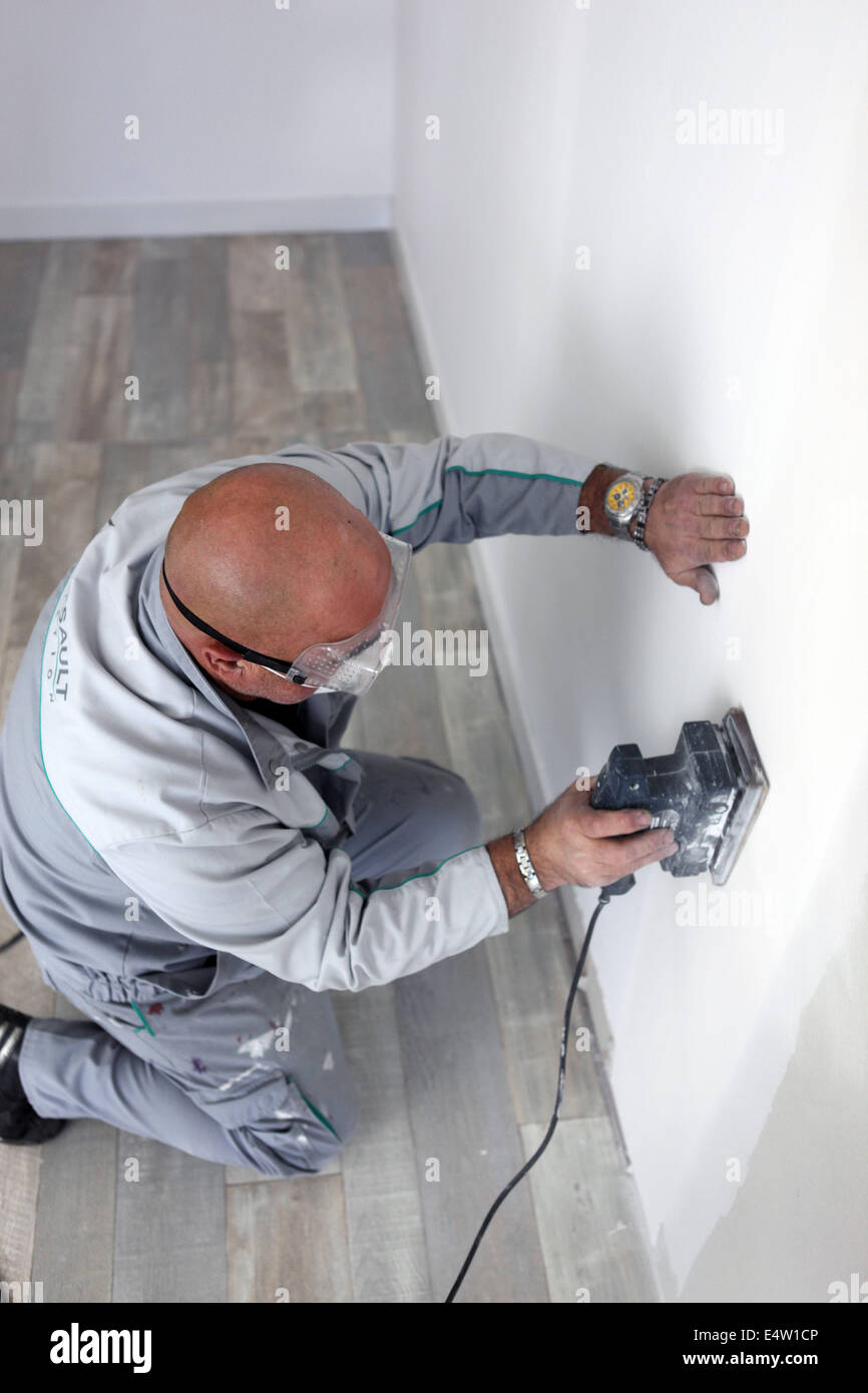 Carpenter using electric belt sander hi-res stock photography and ...