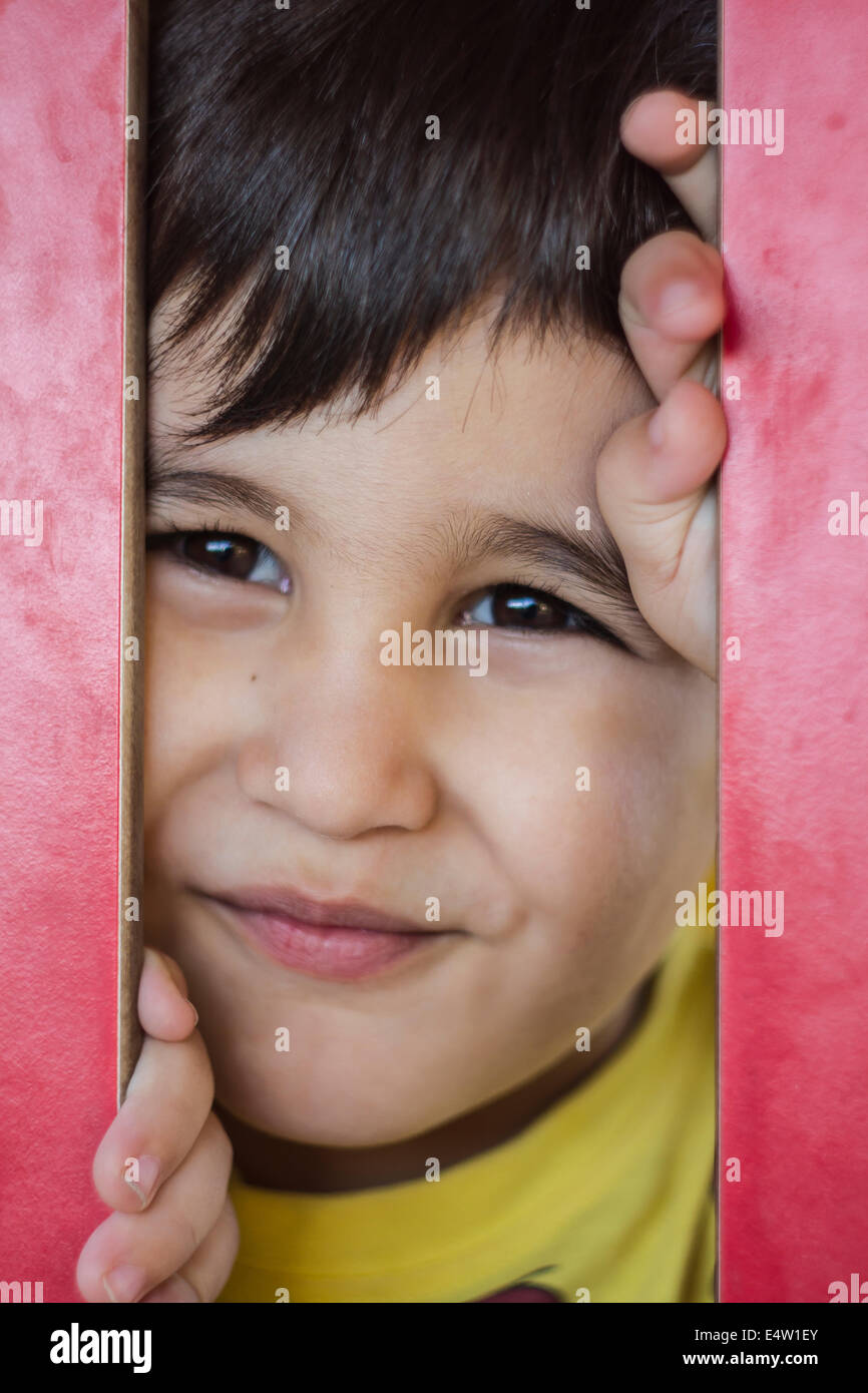 preschool child in a park putting expressive faces Stock Photo - Alamy