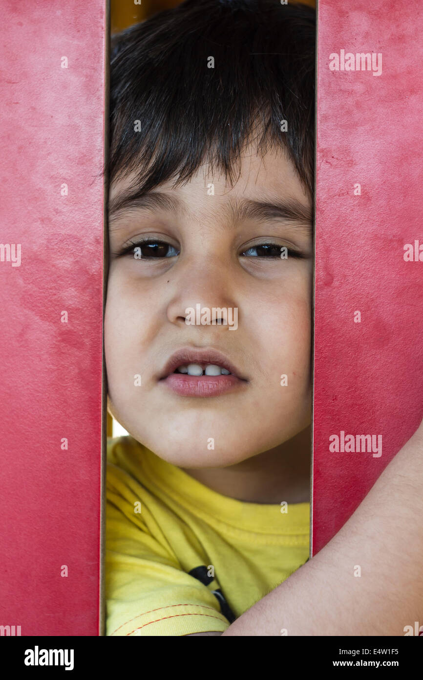 Fun child in a park putting expressive faces Stock Photo - Alamy