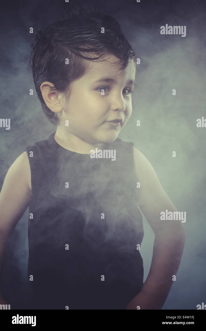 heavy boy dressed rocker with funny faces Stock Photo - Alamy