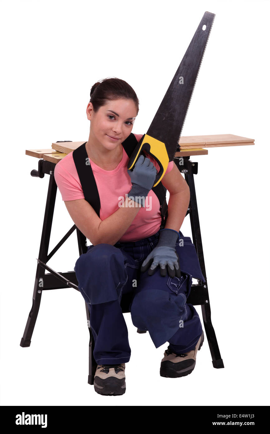Woman with hand-saw Stock Photo - Alamy