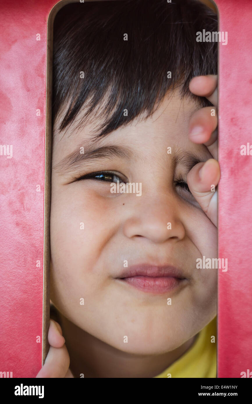 little child in a park putting expressive faces Stock Photo - Alamy