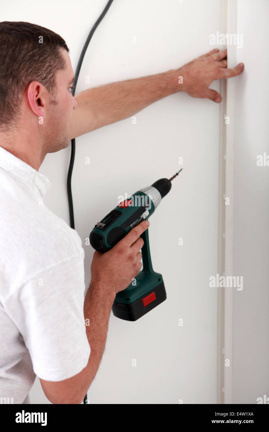 Man using a cordless power drill Stock Photo - Alamy
