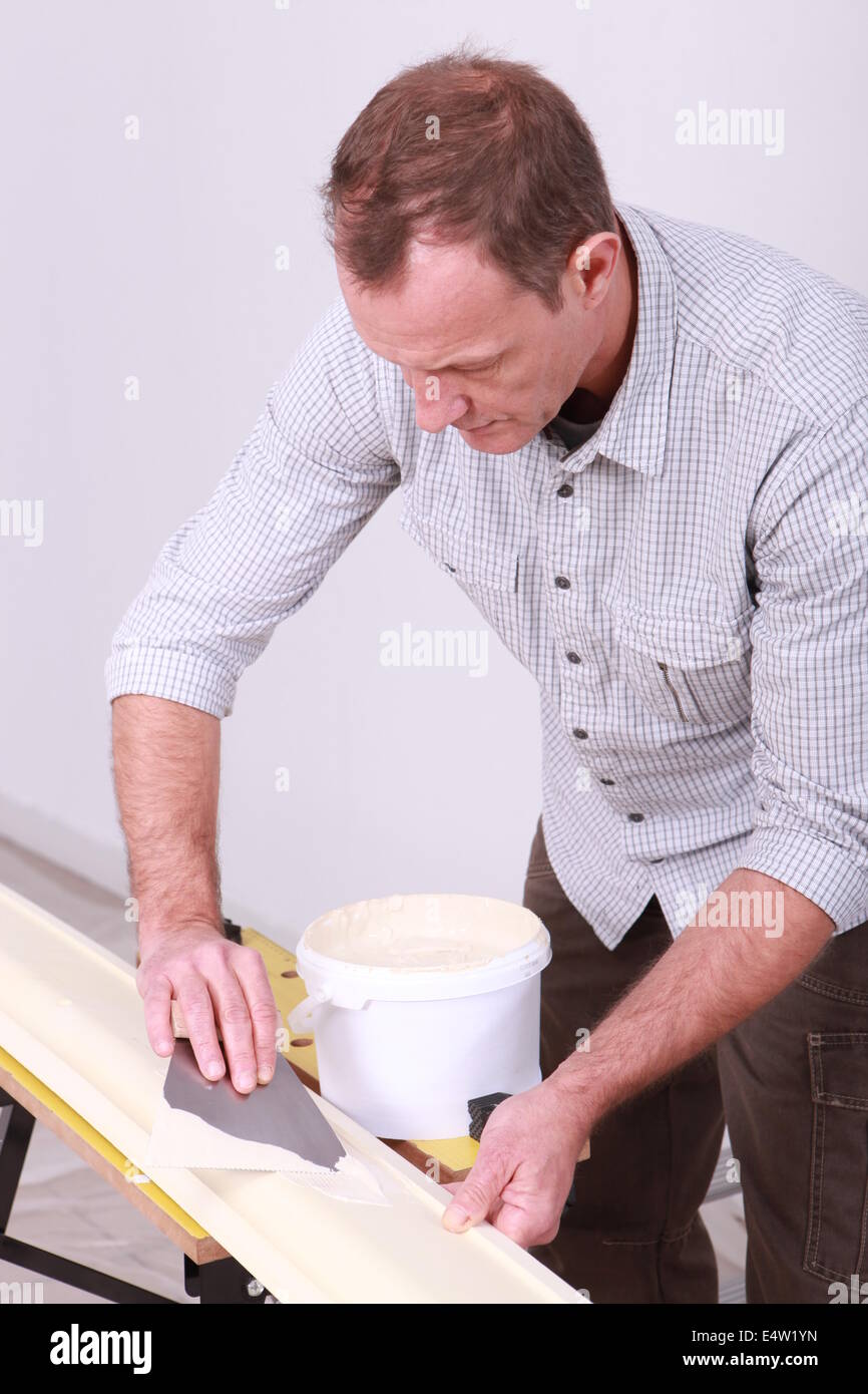 craftsman painting a wooden piece Stock Photo - Alamy