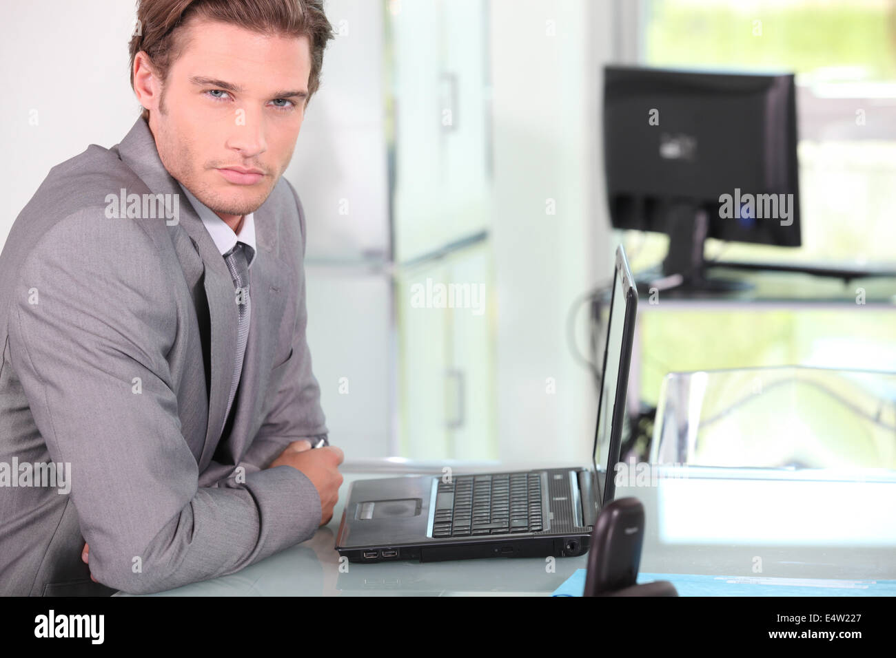 Young businessman on laptop Stock Photo - Alamy