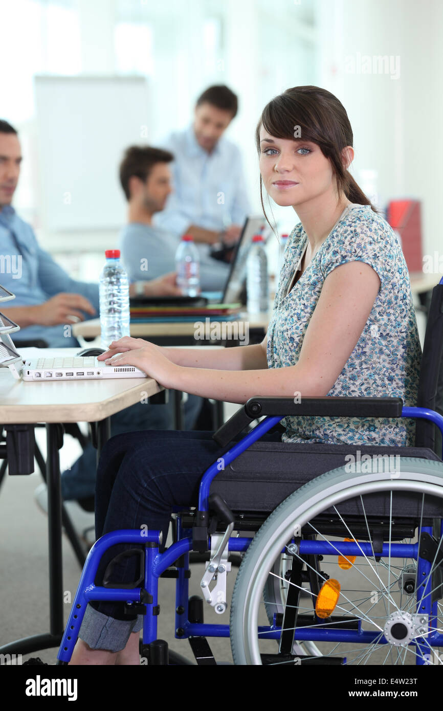 Young woman disabled at work Stock Photo - Alamy