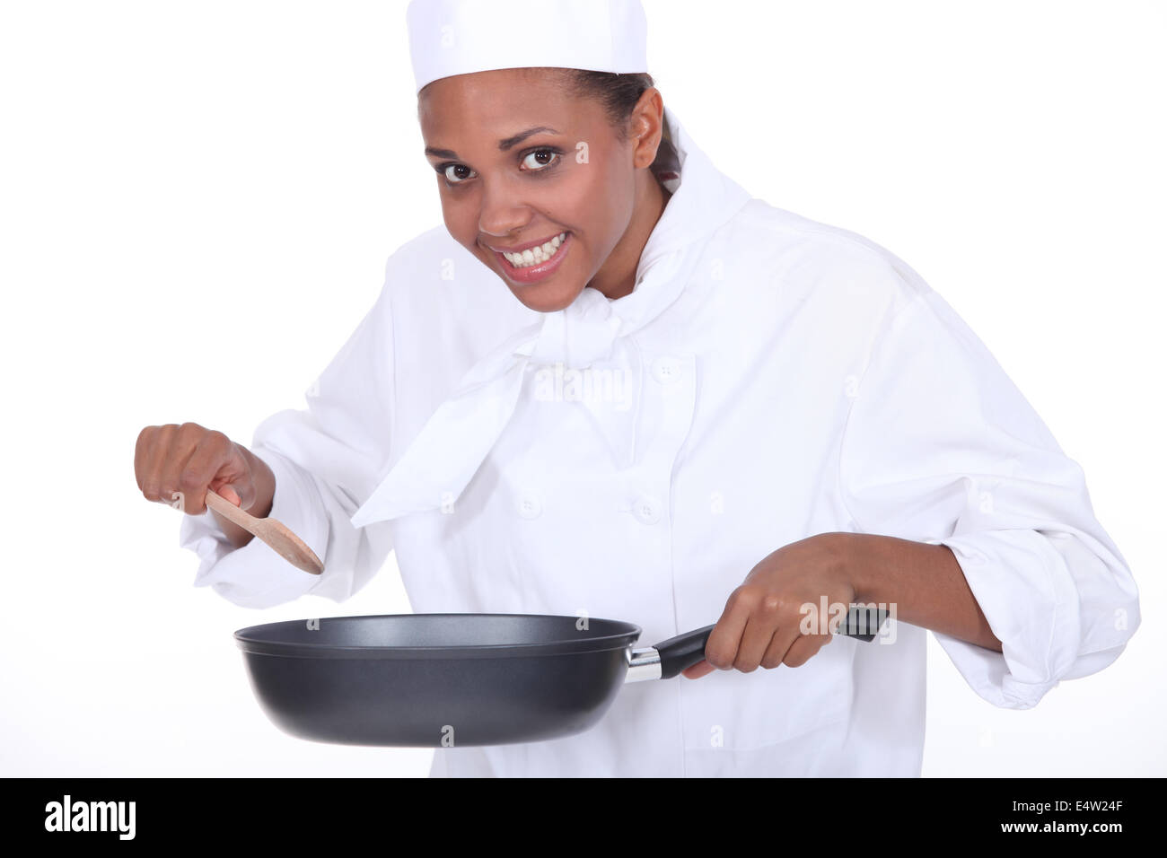 Female chef holding saucepan Stock Photo - Alamy