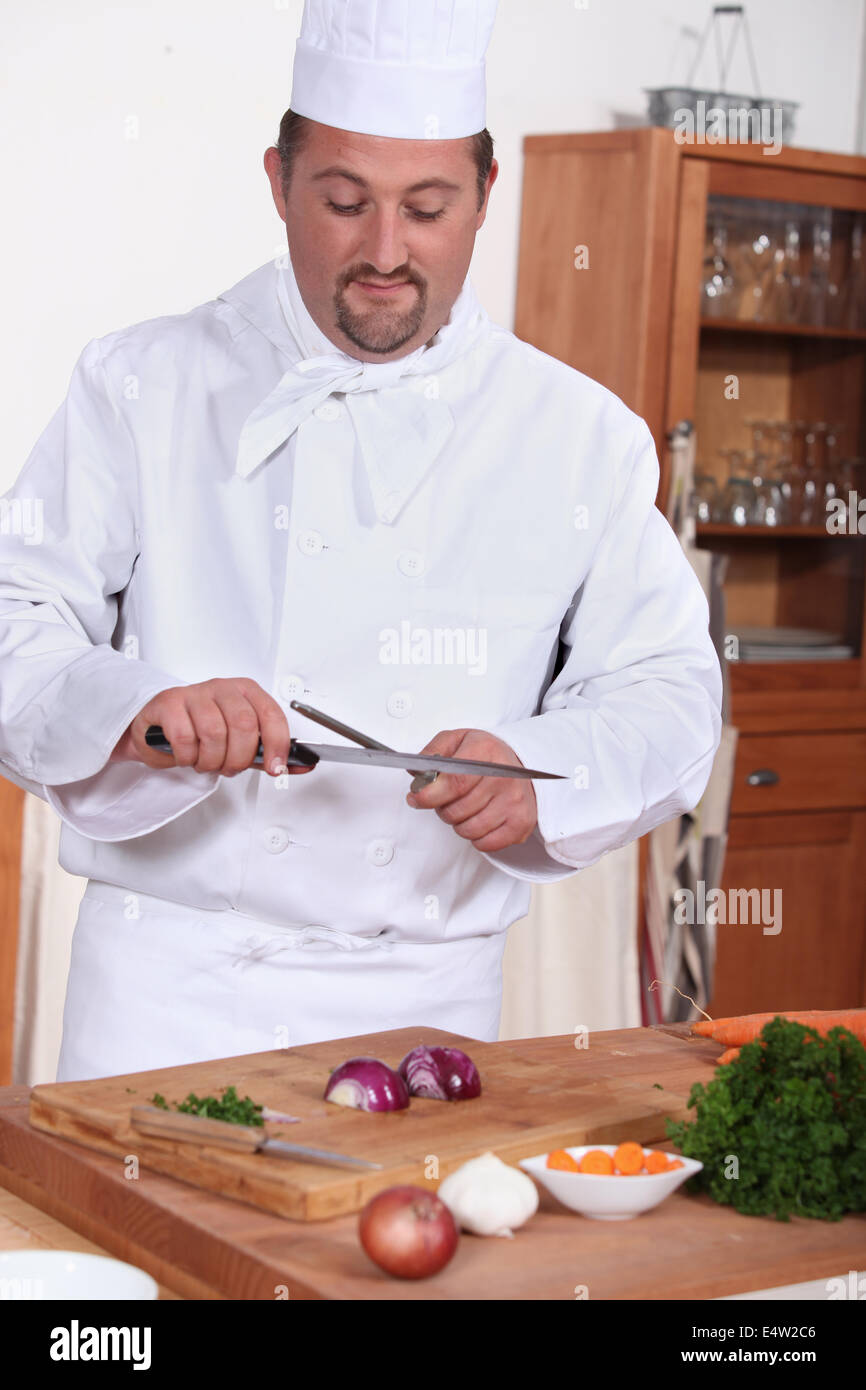 Portrait of a cook in kitchen Stock Photo - Alamy