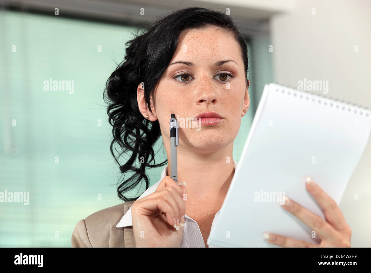 secretary holding a notepad Stock Photo - Alamy