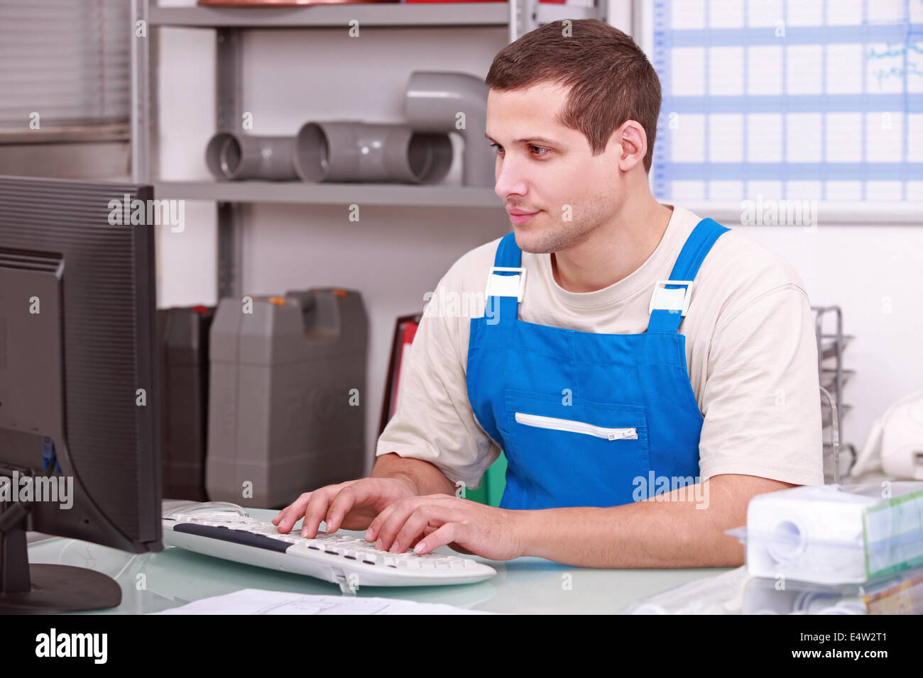 Plumber working in an office Stock Photo - Alamy