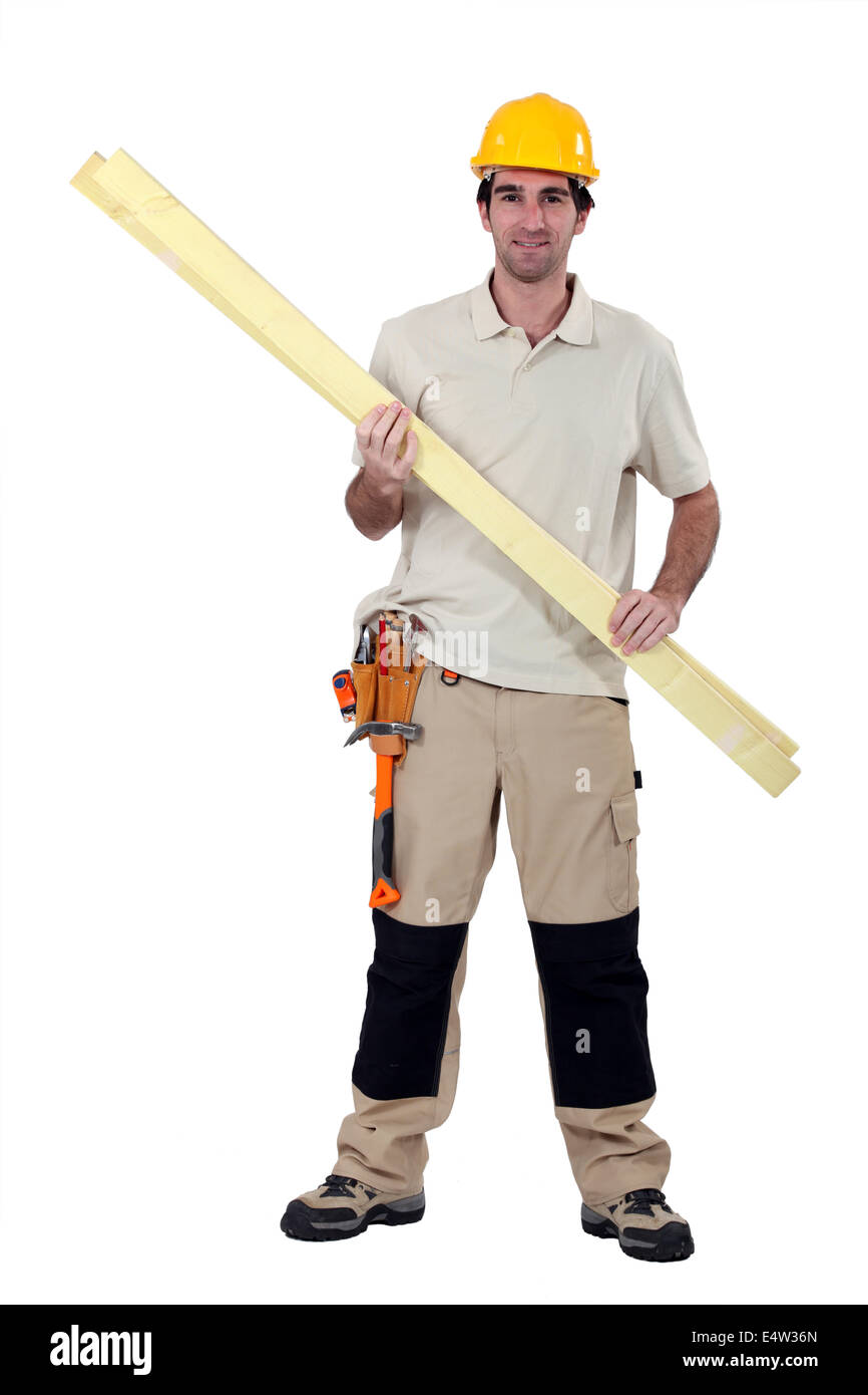 Carpenter with timber Stock Photo - Alamy