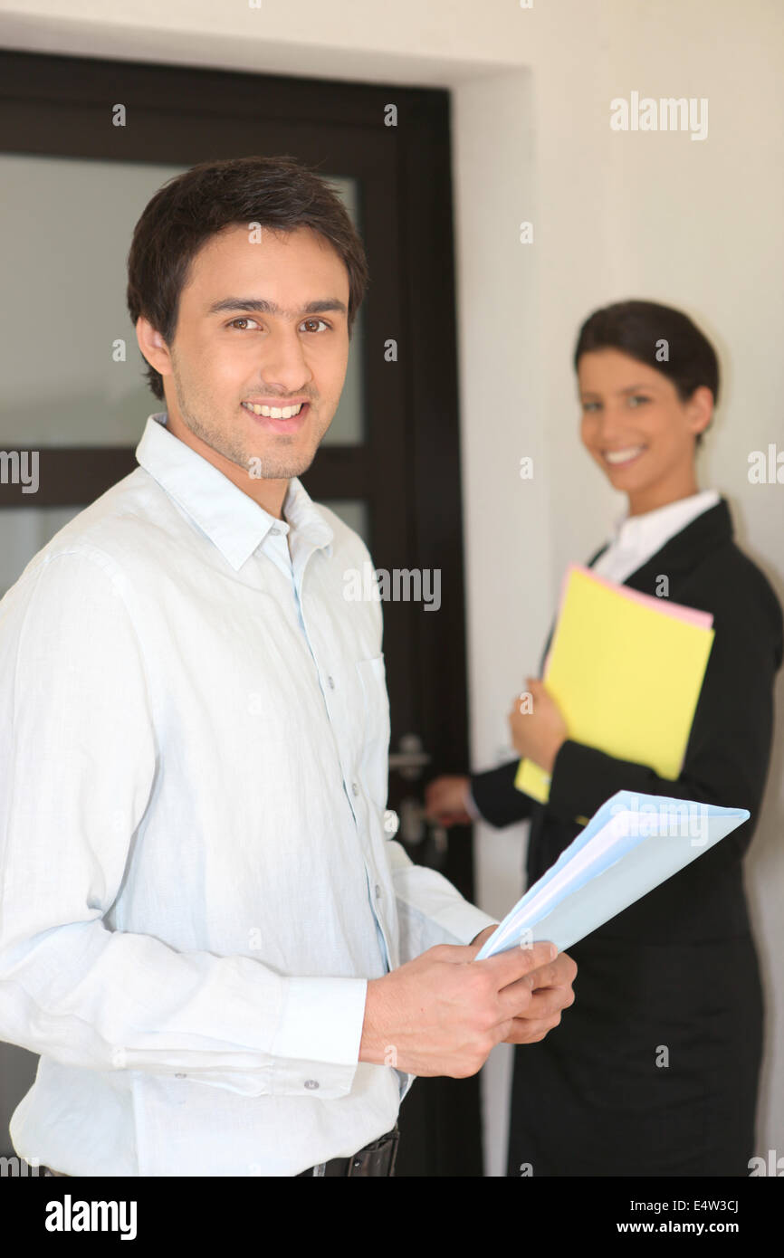 Real-estate agents visiting house Stock Photo - Alamy