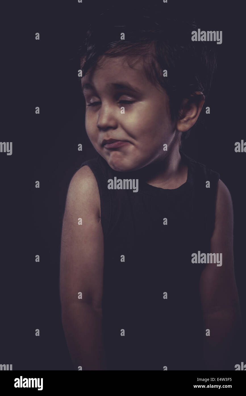 Funny kid with funny faces dressed as a heavy Stock Photo - Alamy