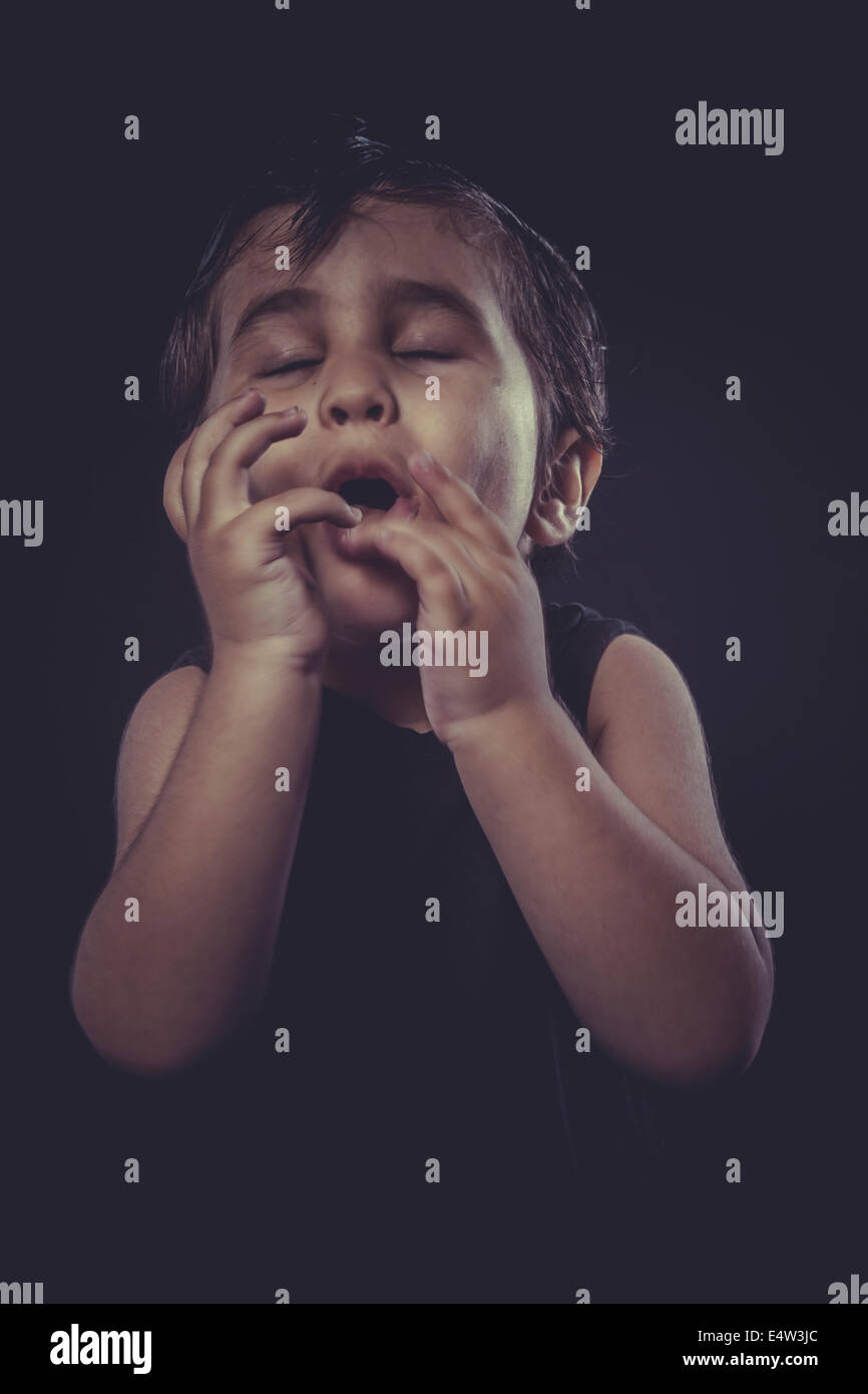 Funny kid with funny faces dressed as a heavy Stock Photo - Alamy