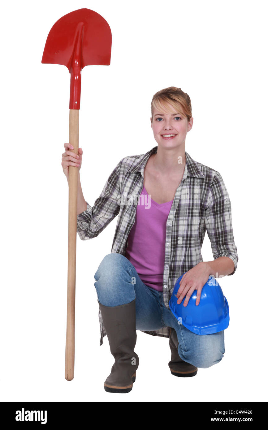 Woman with a shovel Stock Photo - Alamy