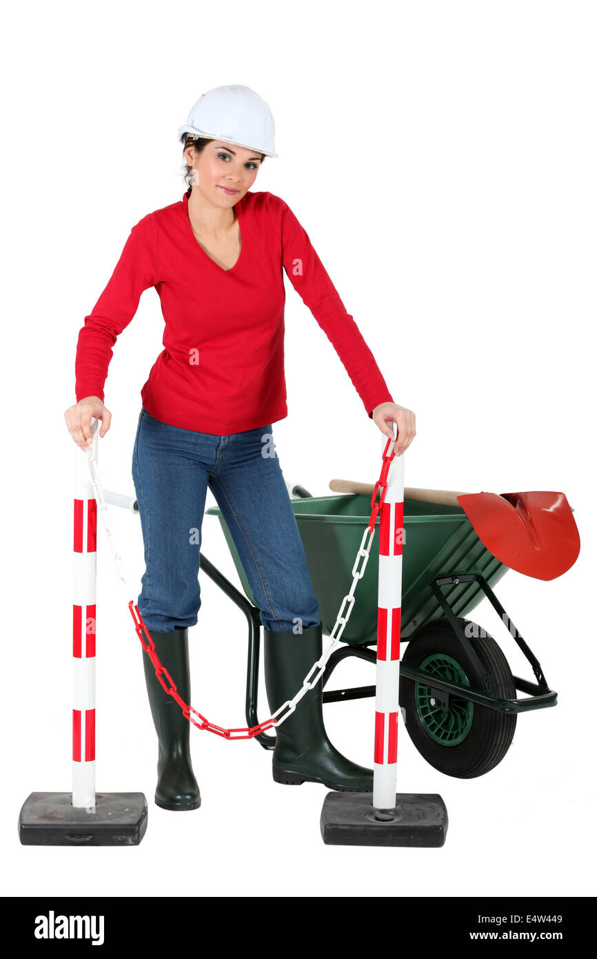 Woman with shovel and wheelbarrow Stock Photo - Alamy