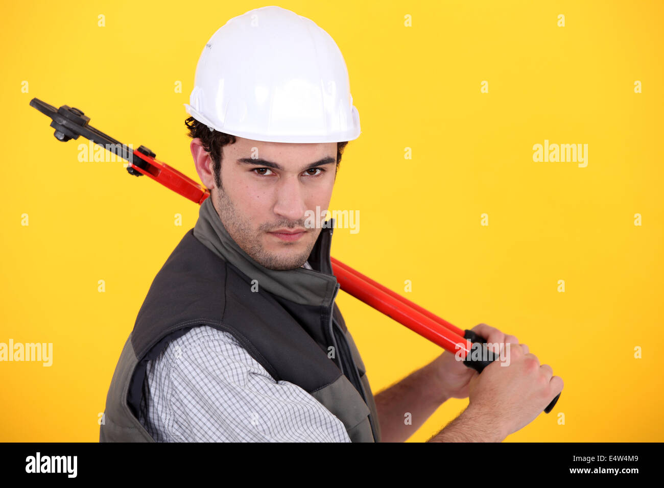Man posing with bolt-cutters Stock Photo - Alamy