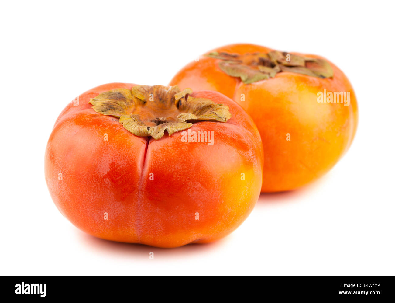 Two persimmon fruits on white background Stock Photo - Alamy