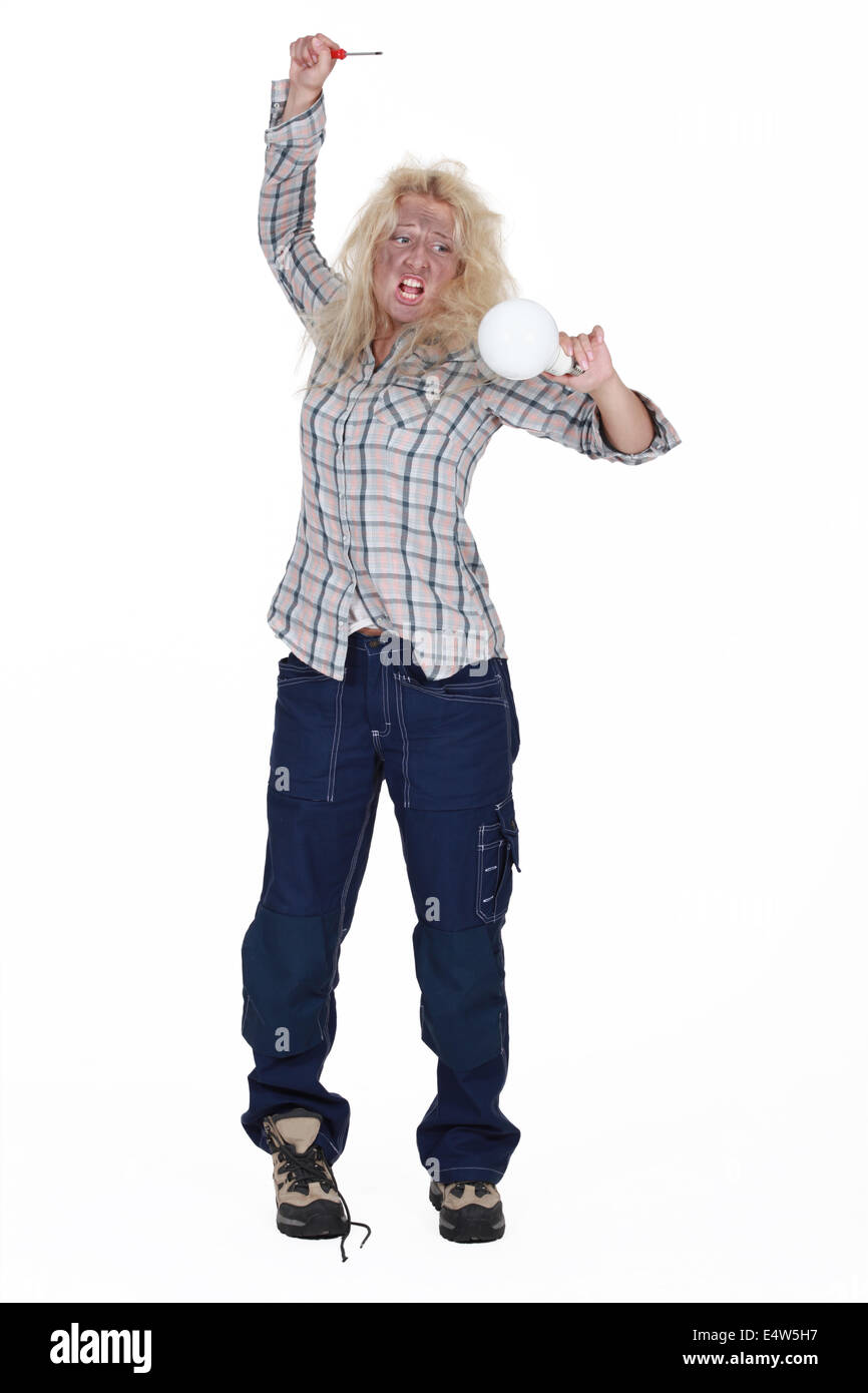 Woman getting an electric shock Stock Photo - Alamy