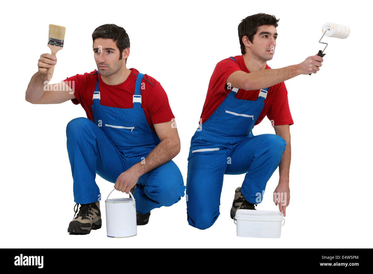 Two male decorators working in unison Stock Photo - Alamy