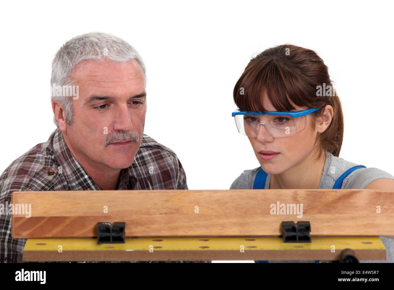 Carpenter and female apprentice Stock Photo - Alamy