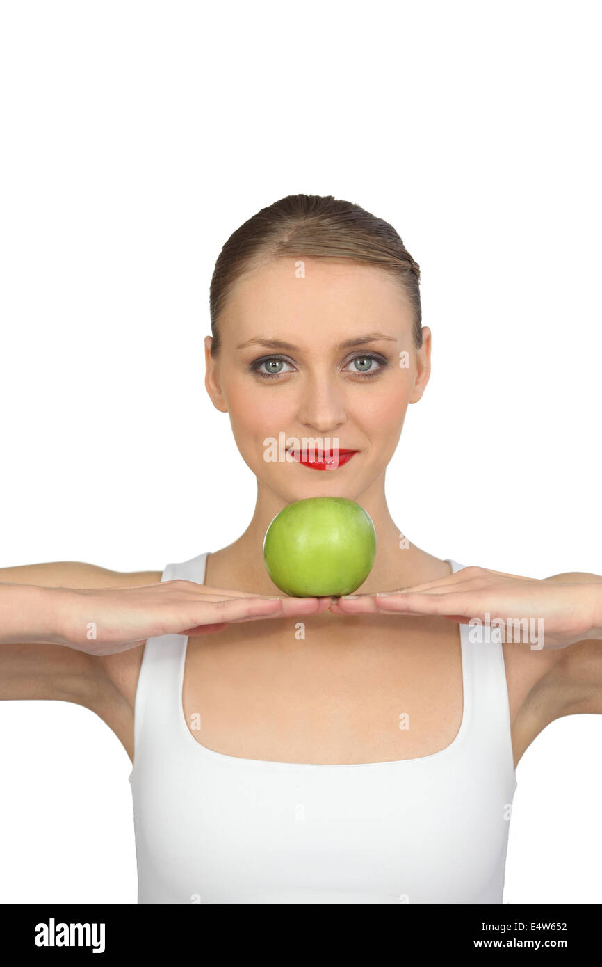 Woman balancing an apple in her hands Stock Photo - Alamy