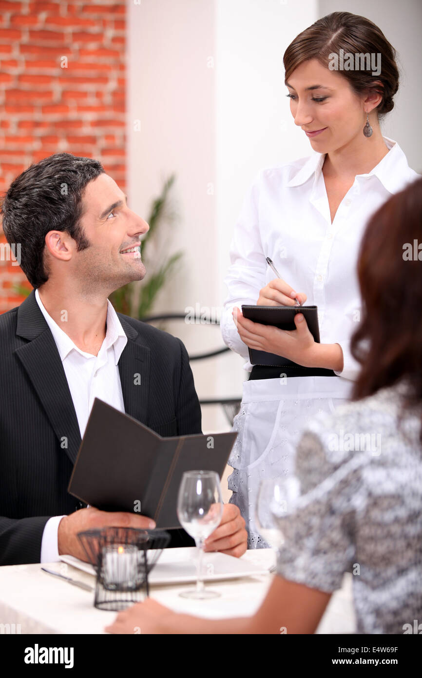 Waitress taking an order Stock Photo - Alamy