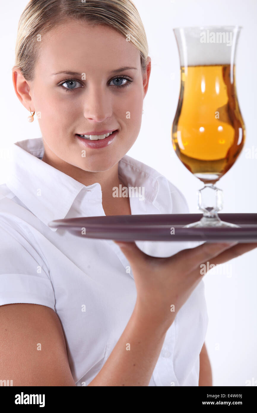 Waitress serving beer Stock Photo - Alamy