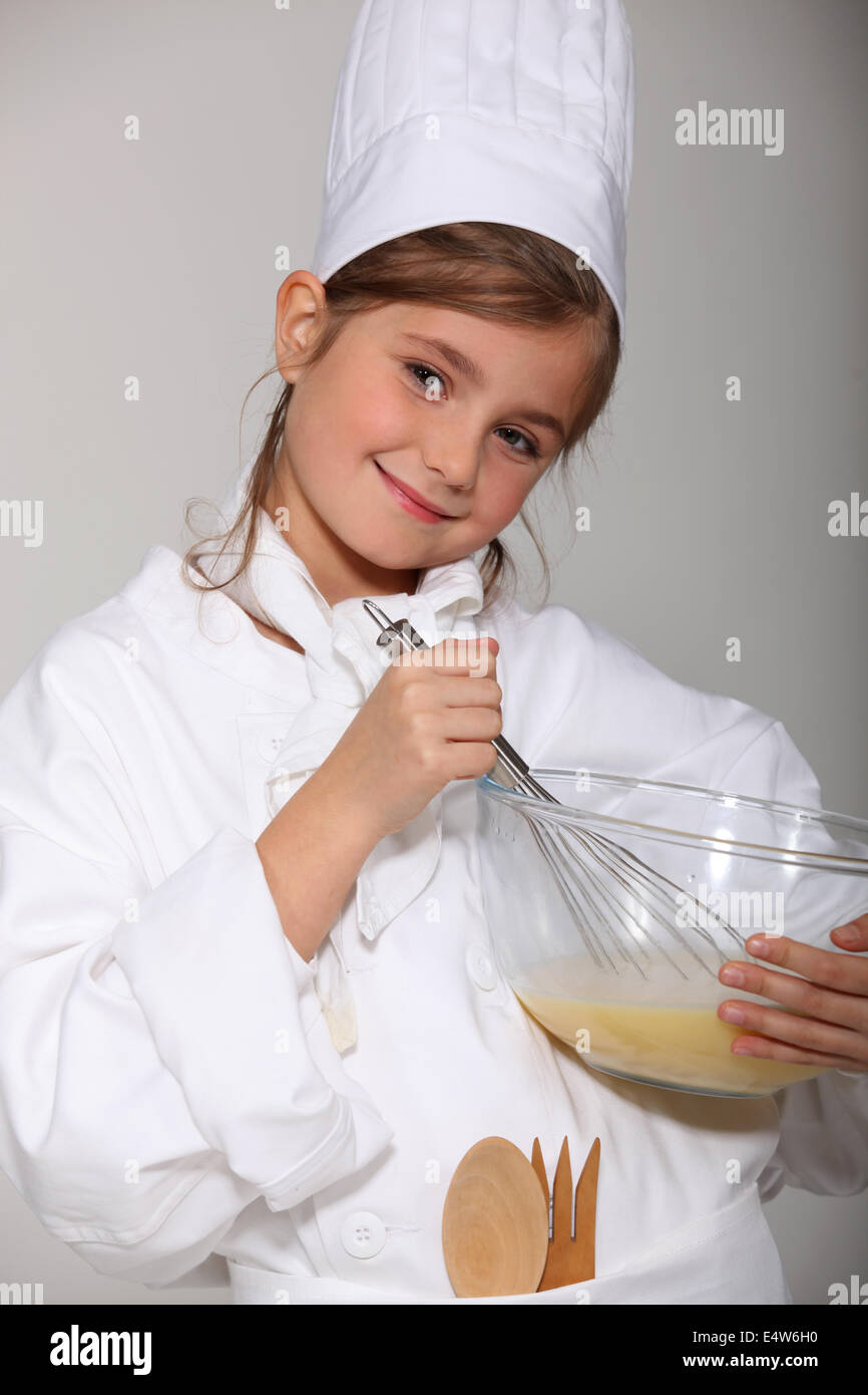 portrait of a little girl in baker clothes Stock Photo - Alamy