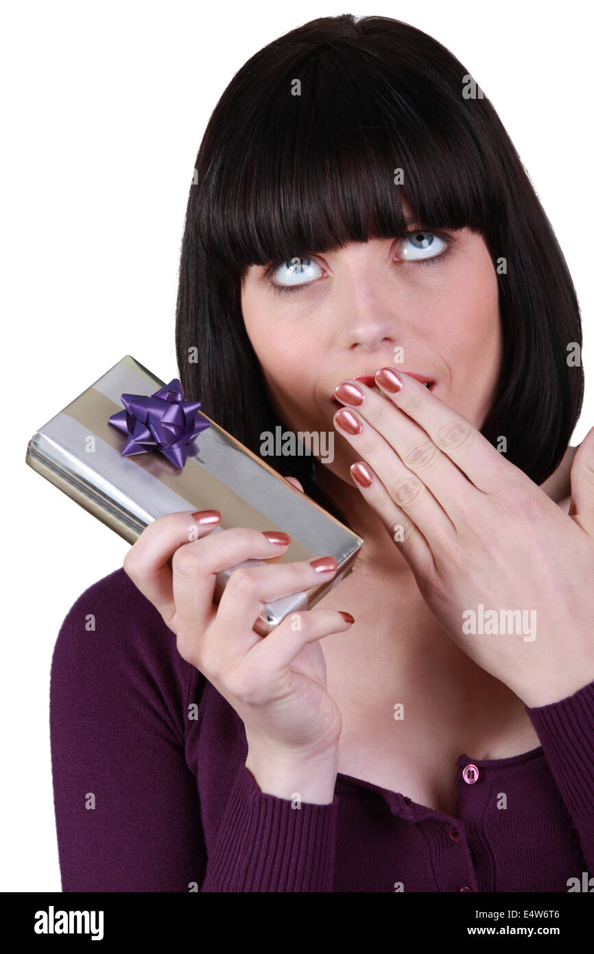 Brunette surprised by gift Stock Photo - Alamy