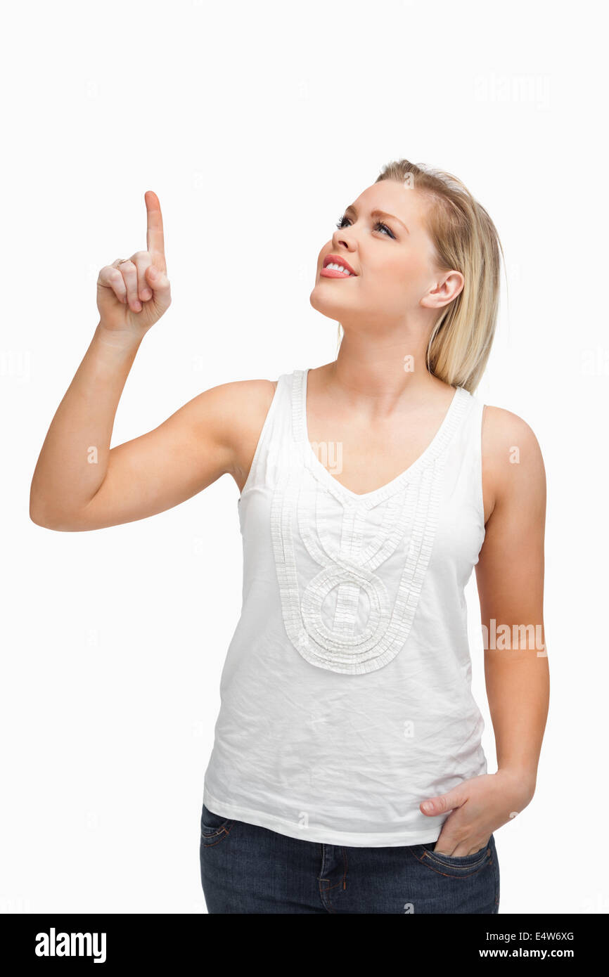 Smiling blonde woman raising finger hi-res stock photography and images ...